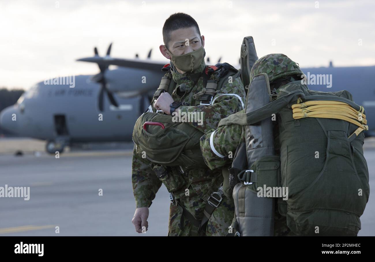 Japan Ground Self-Defense Force soldiers perform equipment checks at ...
