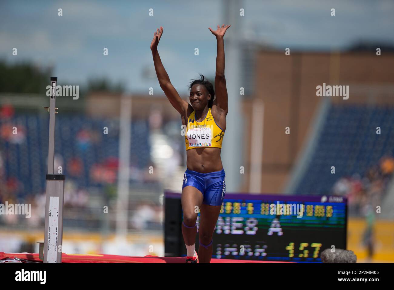July 22, 2015: Akela Jones of Barbados celebrates clearing the bar in ...