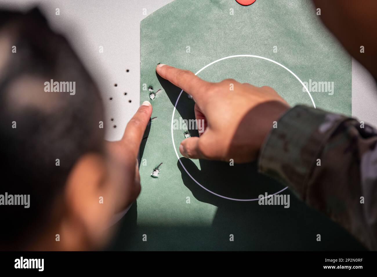 U.S. Airmen assigned to the 60th Air Mobility Wing review their targets ...
