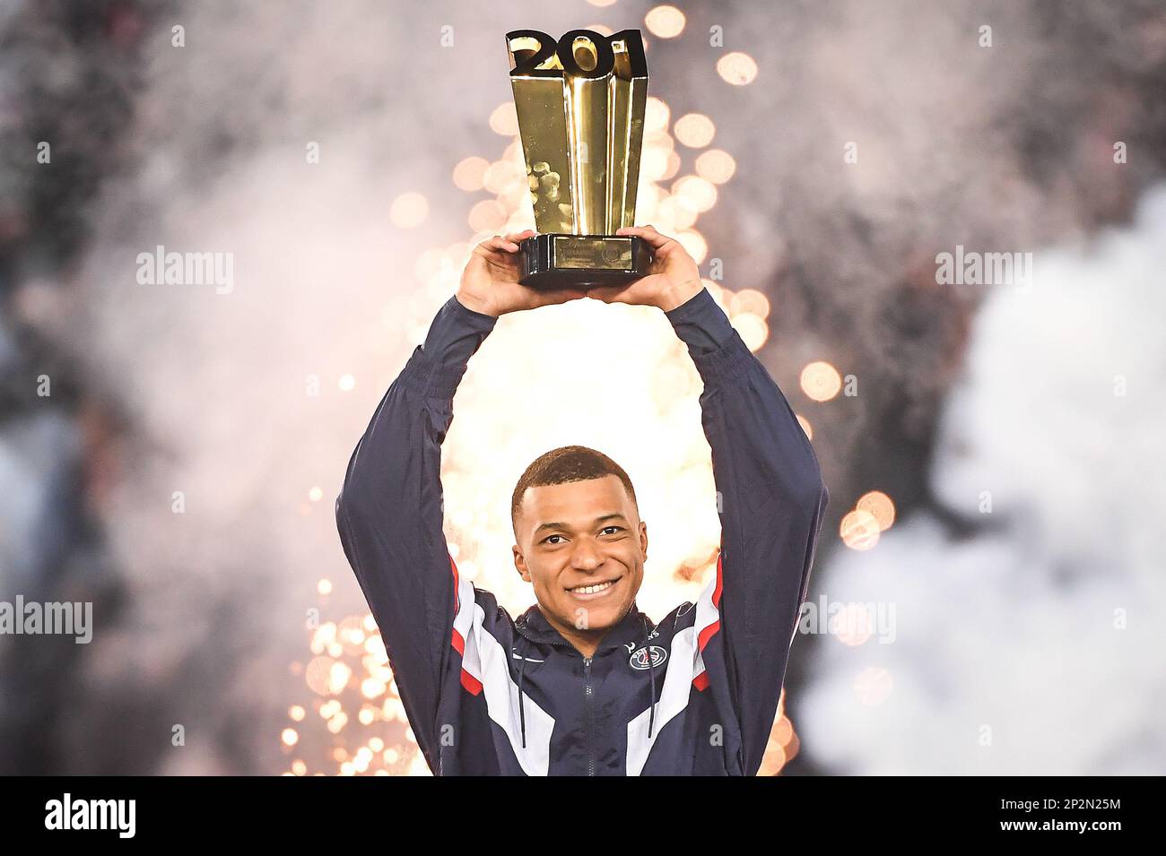 Kylian MBAPPE of PSG celebrates with a trophy during the ceremony after ...