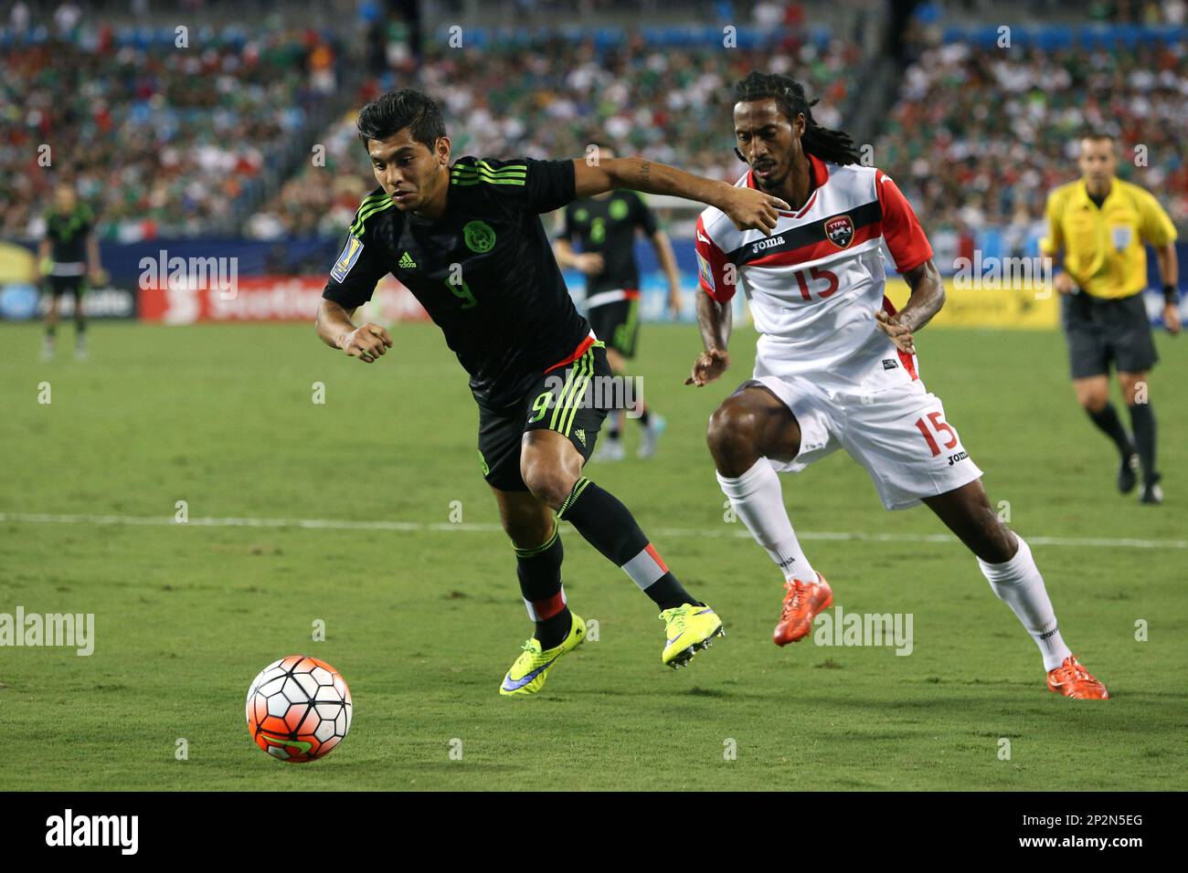 15 July 2015: Jesus Corona (MEX) (9) and Dwane James (TRI) (15). The ...