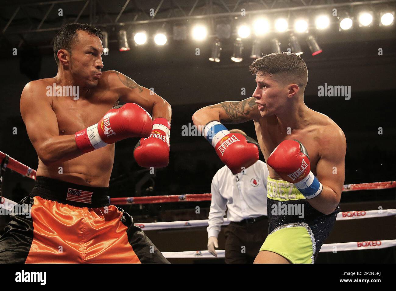 Jovan Perez (R) fights against Juan Aguirre during a Telemundo boxing ...