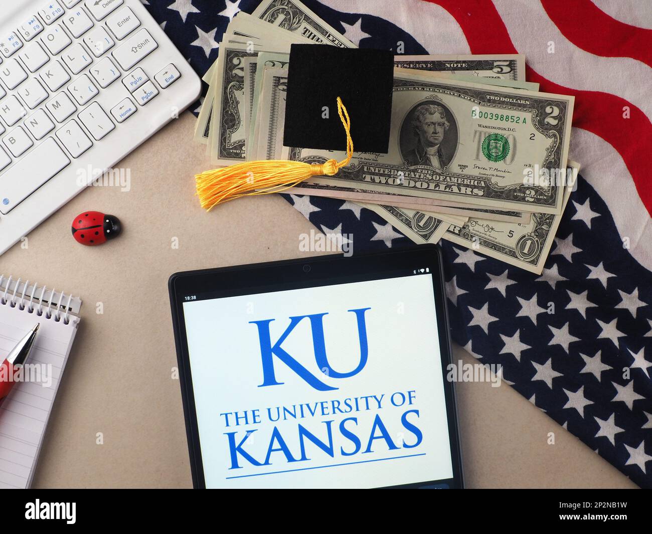 In this photo illustration, the University of Kansas logo seen ...