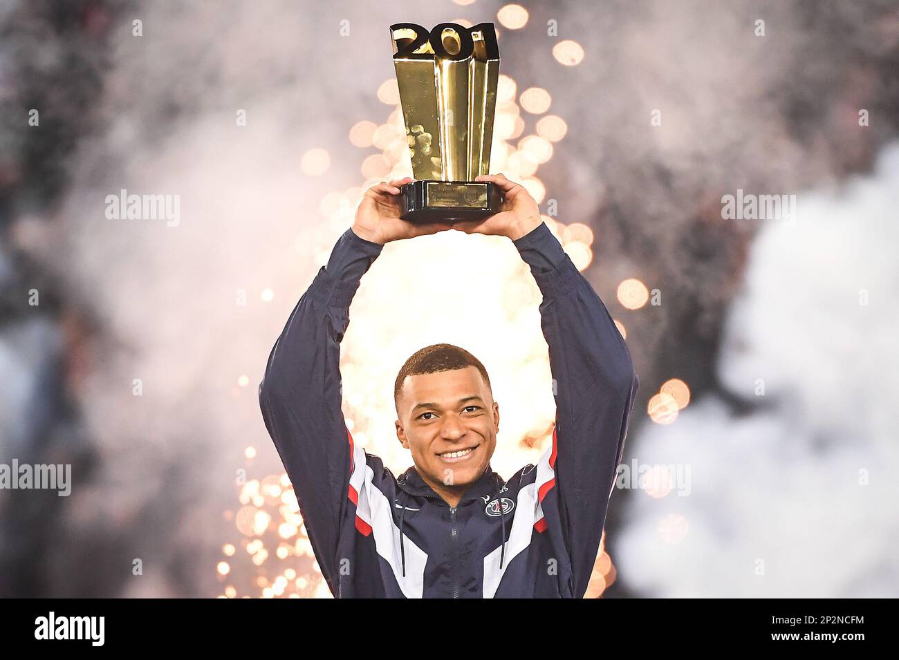 Kylian MBAPPE of PSG celebrates with a trophy during the ceremony after ...