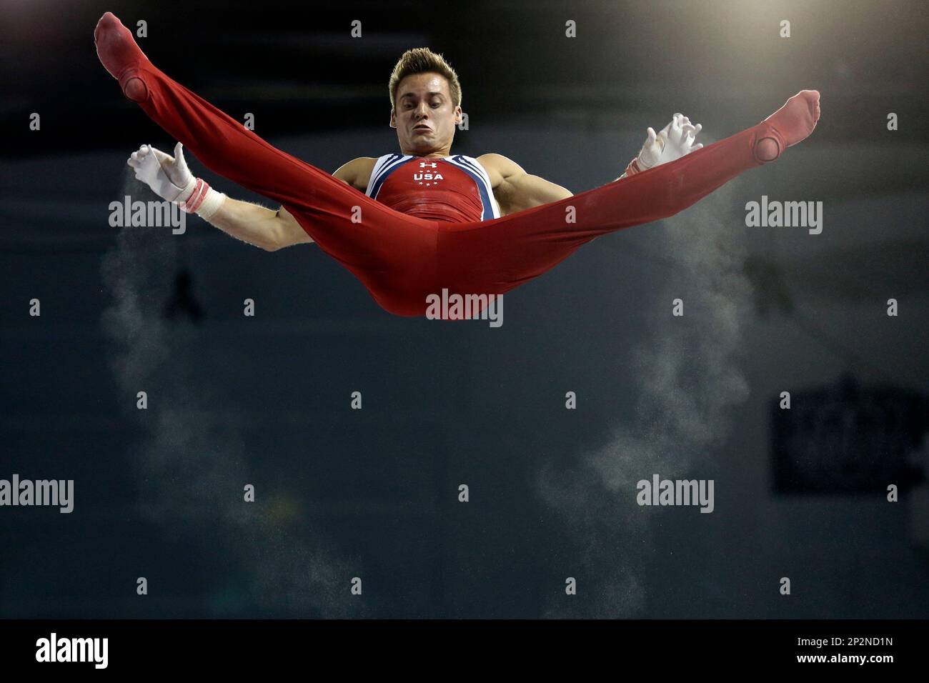 Trails of chalk follow the hands of the United States' Sam Mikulak ...