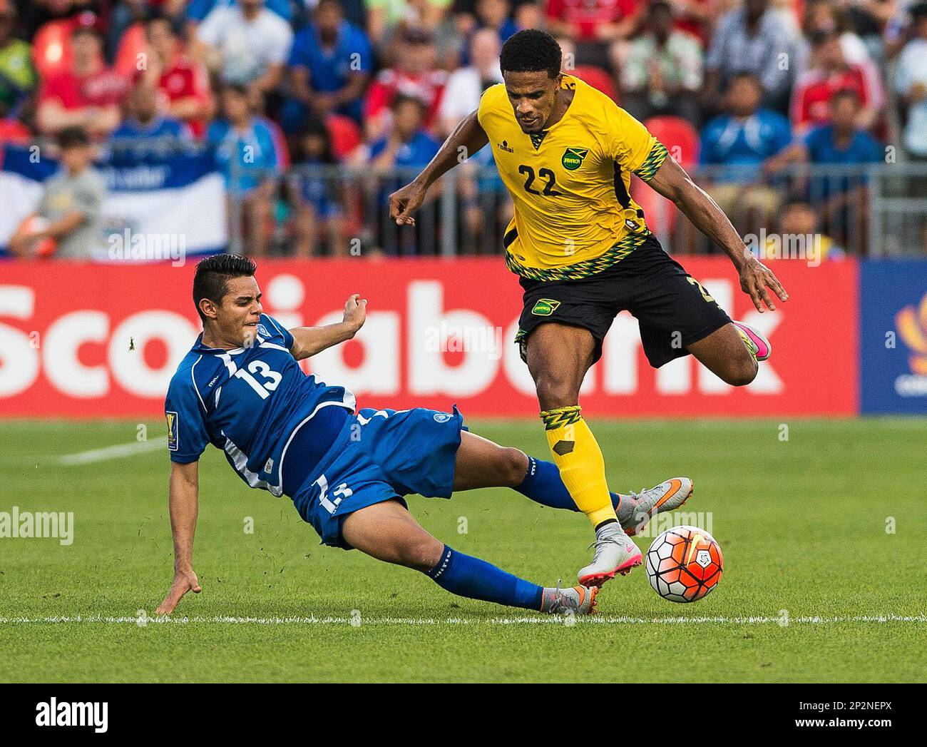Jamaica's Gareth McCleary, right, has his feet kicked out from under ...