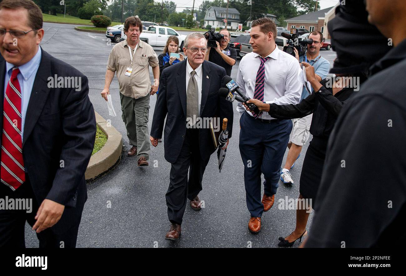 Former Harrisburg Mayor Stephen Reed, center, walks with attorney Henry ...