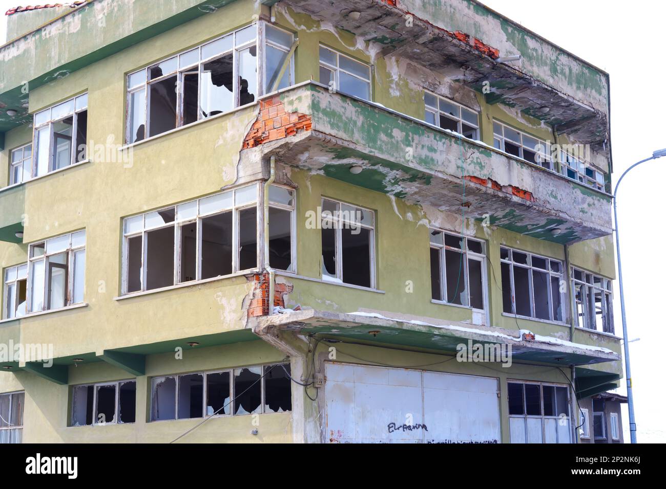 Old residental building with broken windows and damaged walls at city ...