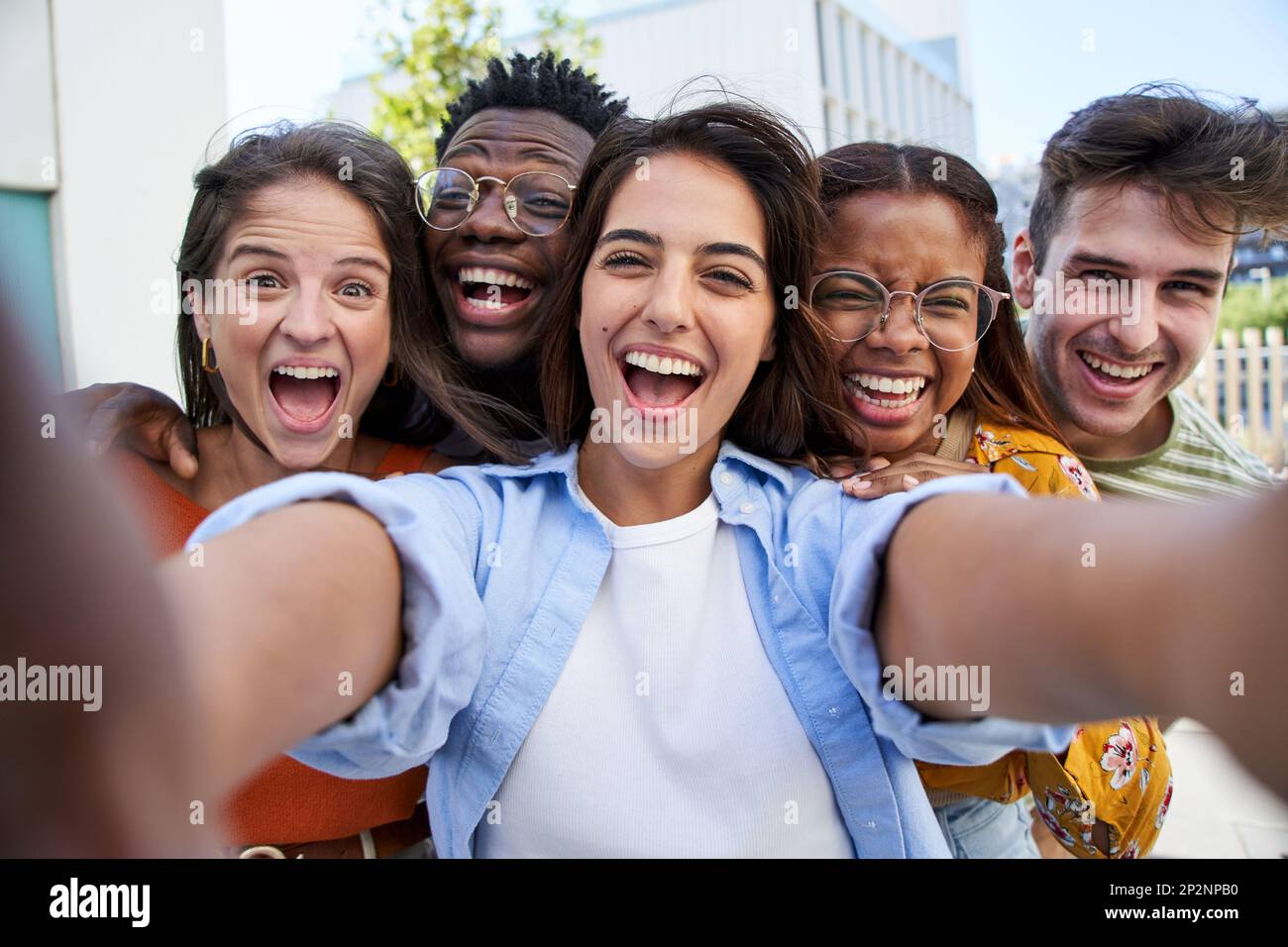 Five young happy students hugging hi-res stock photography and images ...