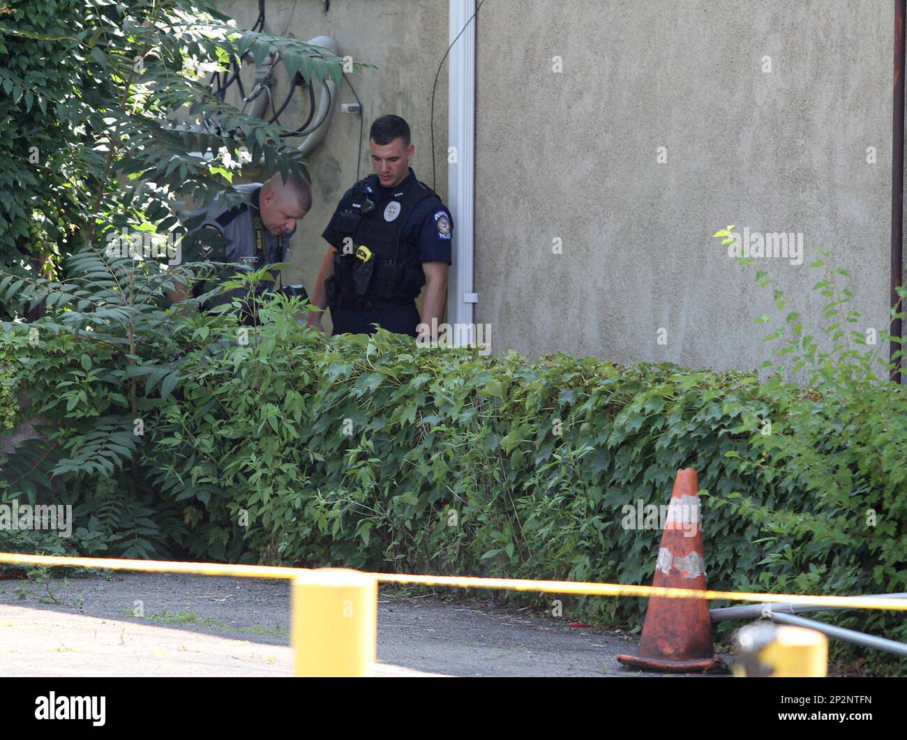 A Pennsylvania State Police Trooper and Dunmore Police officer look at the site where Scranton ...