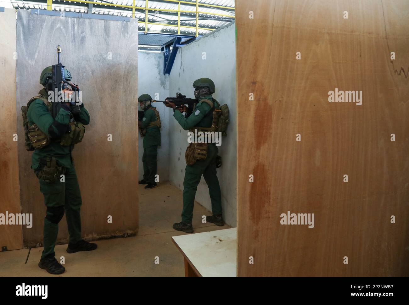 Ivorian Special Forces Soldiers execute tactical movements through a ...