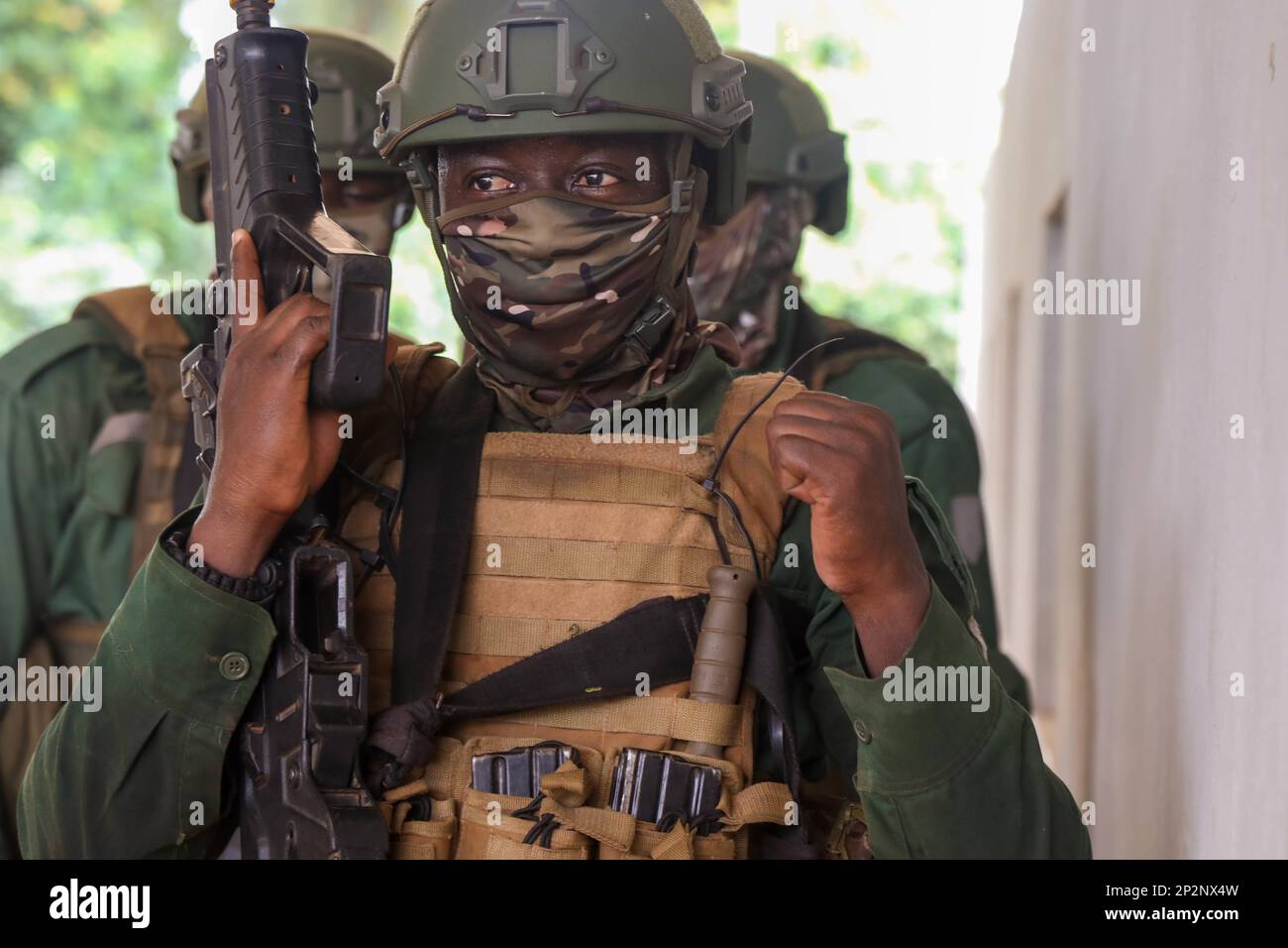 Ivorian Special Forces Soldiers prepare to enter a room at a simulated ...