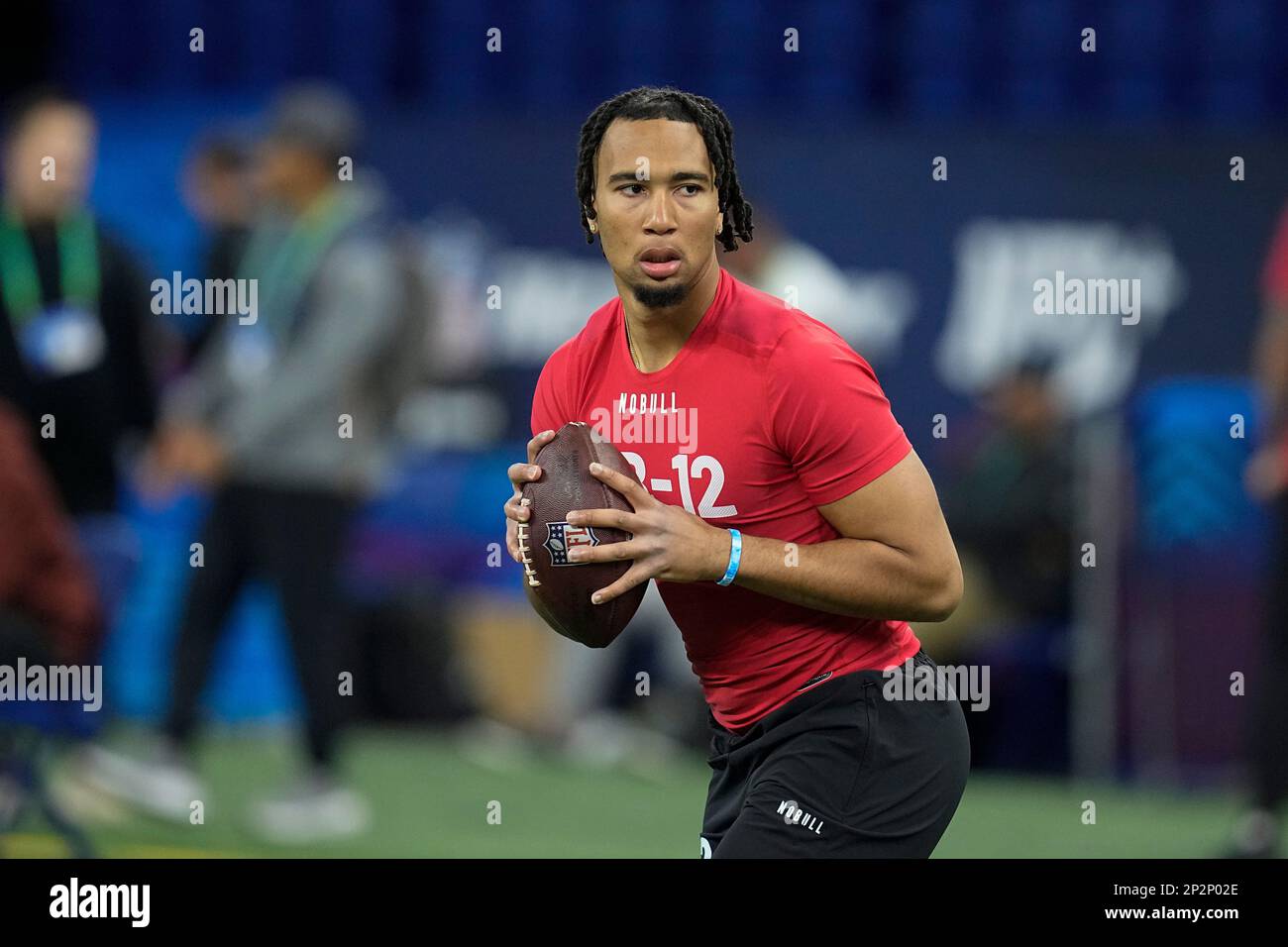 Ohio State quarterback CJ Stroud runs a drill at the NFL football scouting combine in ...