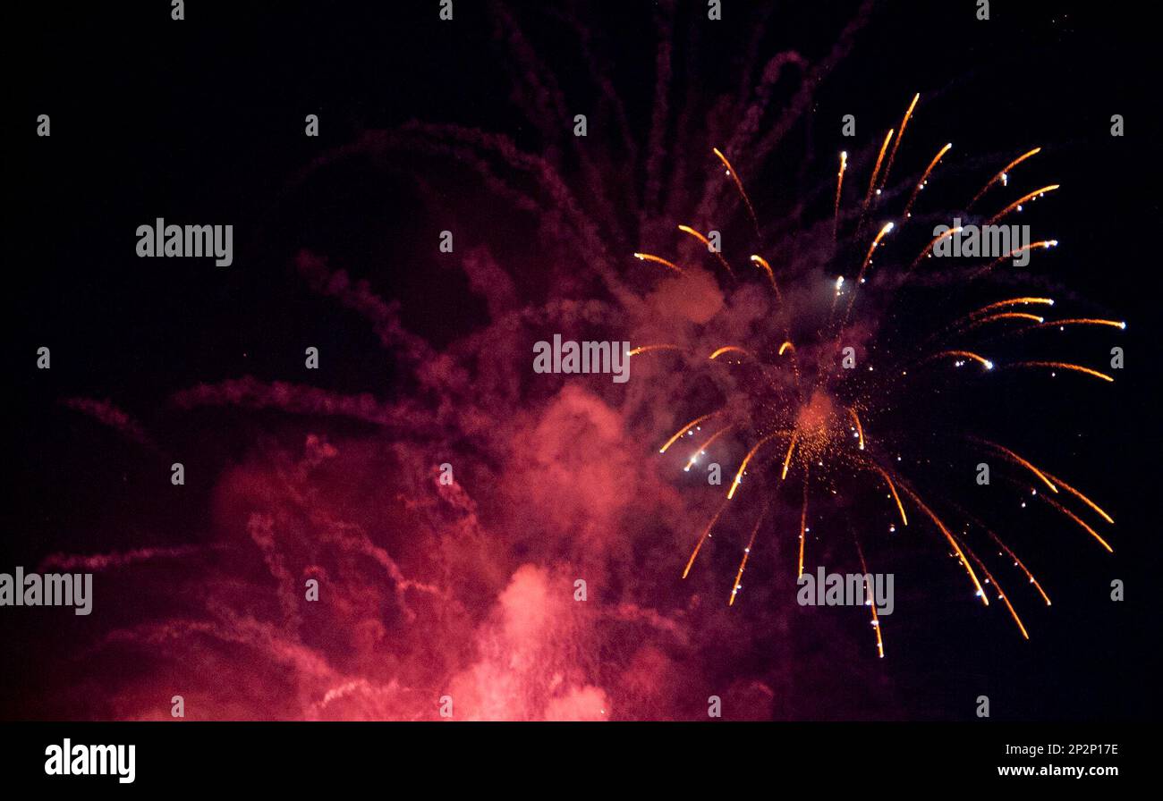Fireworks burst above Cascade Falls during a Fourth of July fireworks ...
