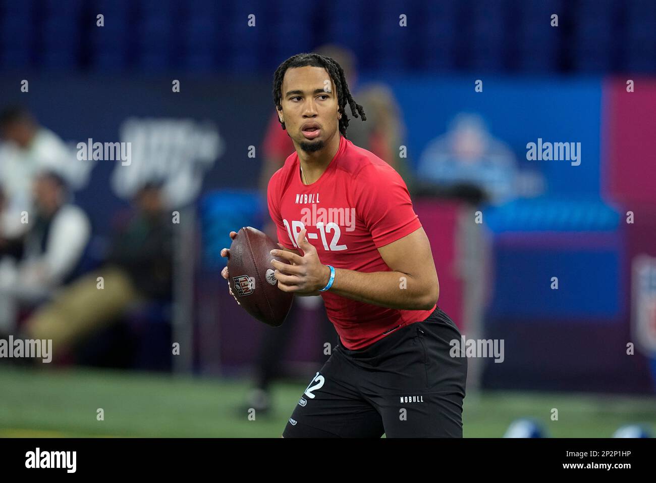 Ohio State quarterback CJ Stroud runs a drill at the NFL football scouting combine in ...