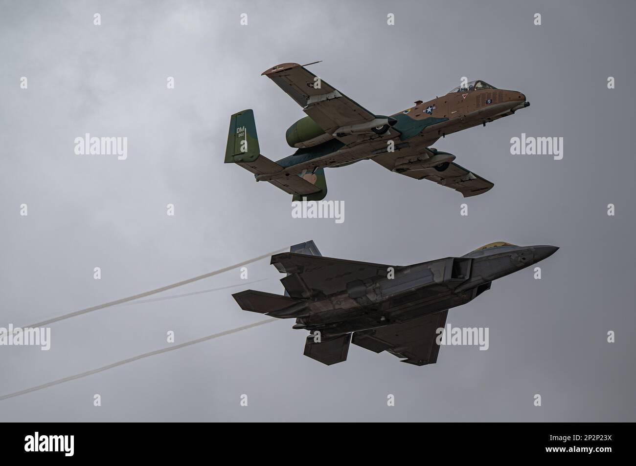 A U.S. Air Force A-10C Thunderbolt II flies alongside an F-22 Raptor ...