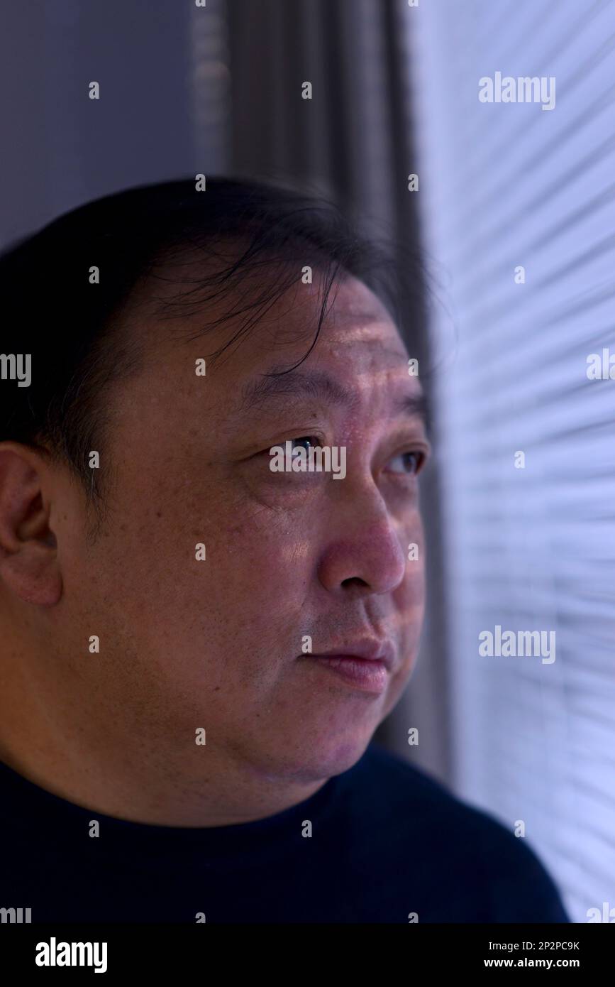 Hong Kong film director Jing Wong poses for photos in his studio in ...