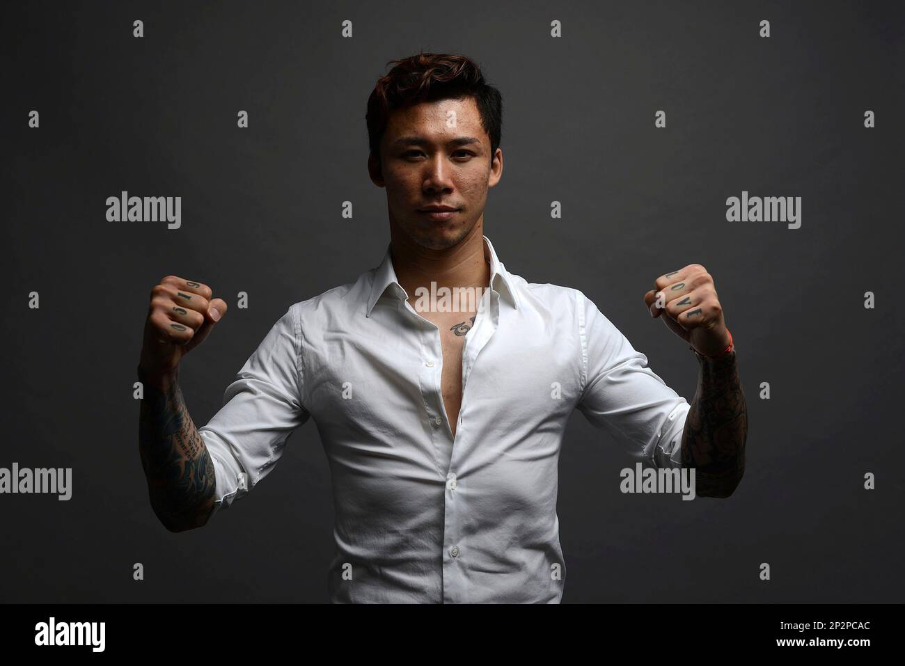 Chinese soccer star Zhang Linpeng poses for photos as he is elected as ...