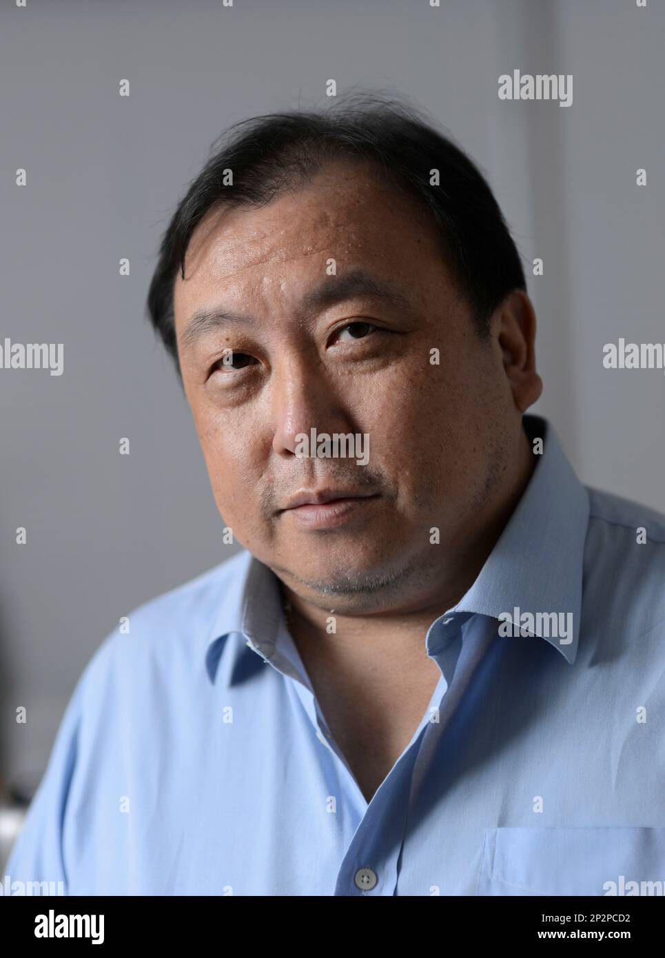 Hong Kong film director Jing Wong poses for photos in his studio in ...