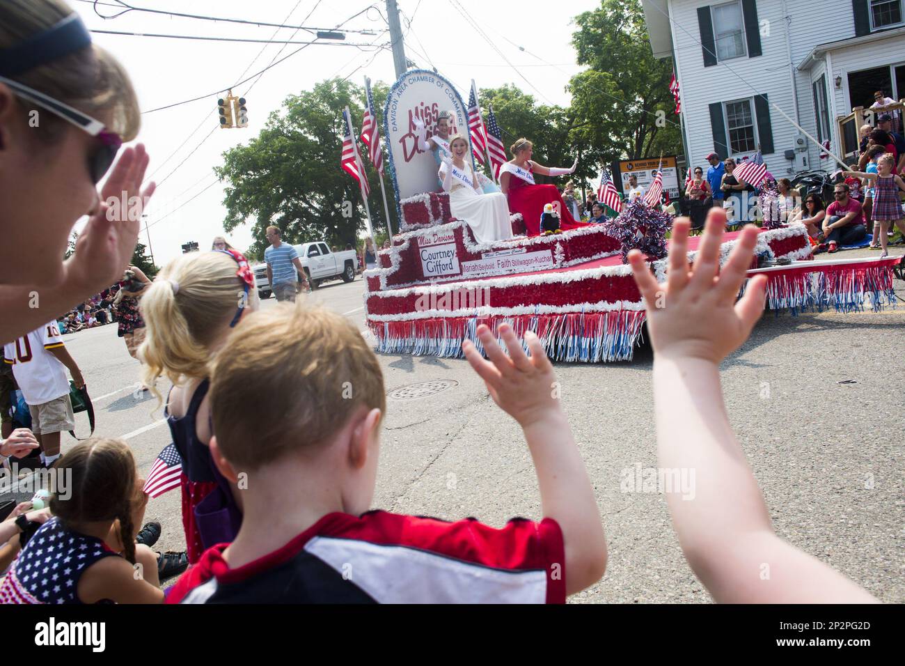 Spectators line the street for the Fenton Freedom Festival parade ...