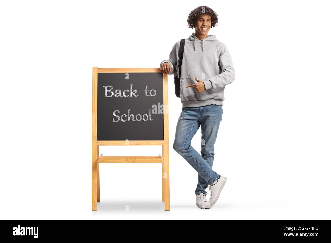 African american male student pointing at a blackboard with text back ...