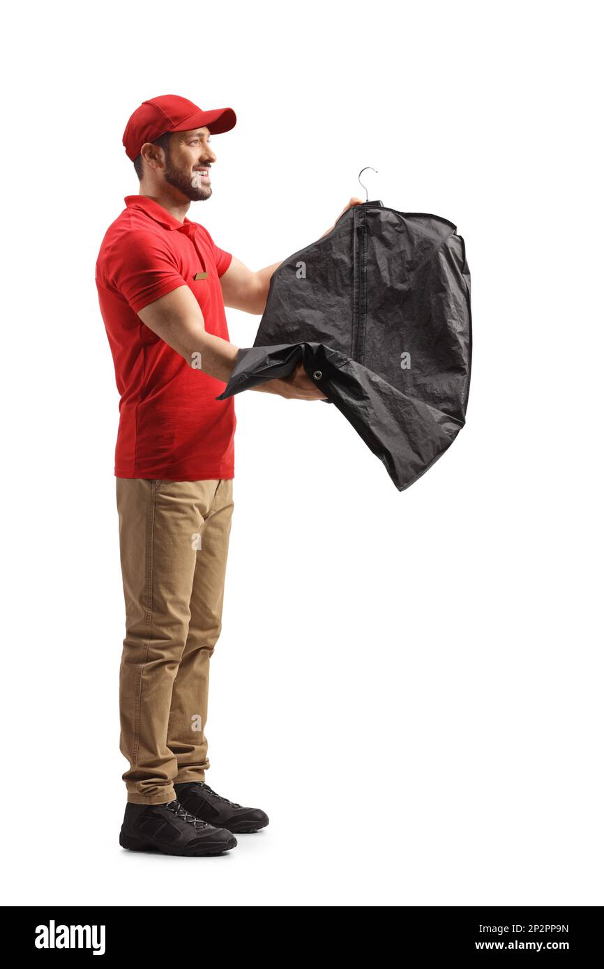 Full length profile shot of a man delivering clothes from dry cleaners ...