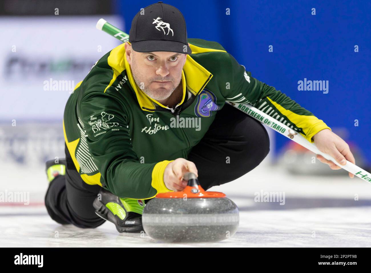 Team Northern Ontario third, Darren Moulding makes a shot against Team ...