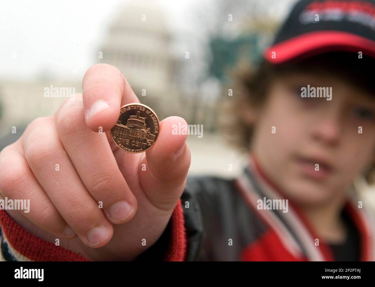 Elijah Wireman, 10, of Ohio, shows off his new one-cent coin, the 4th ...