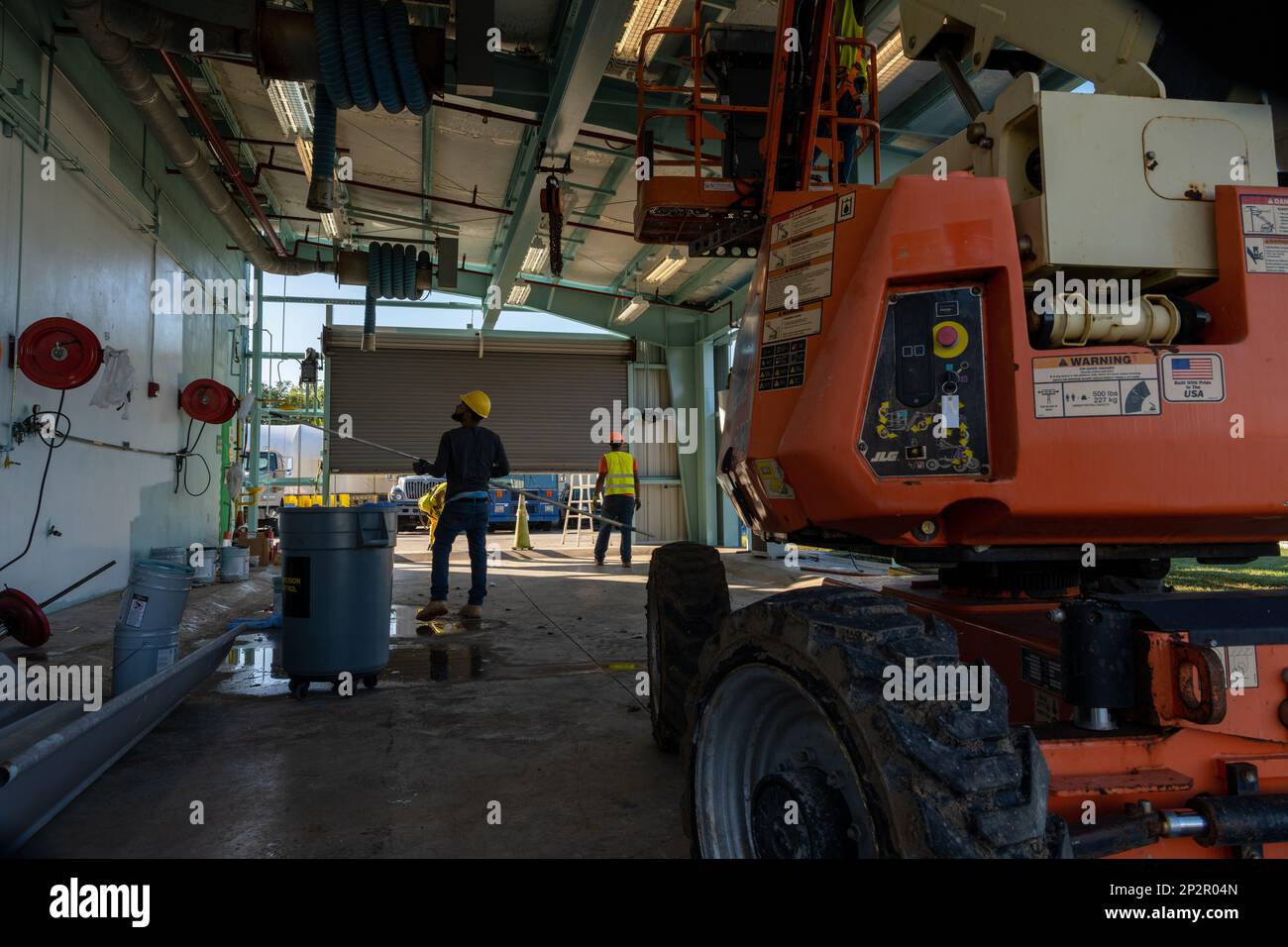 Civilian contractors with J&J Builders Contractors Group Corp., a small ...