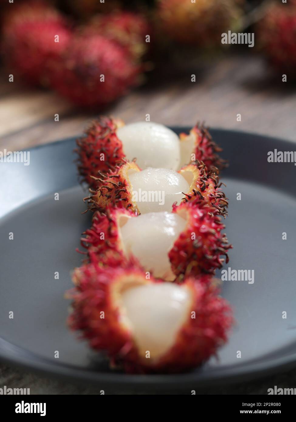 Delicious and sweet, Rambutan, tropical asia fruits, in black plate, on ...