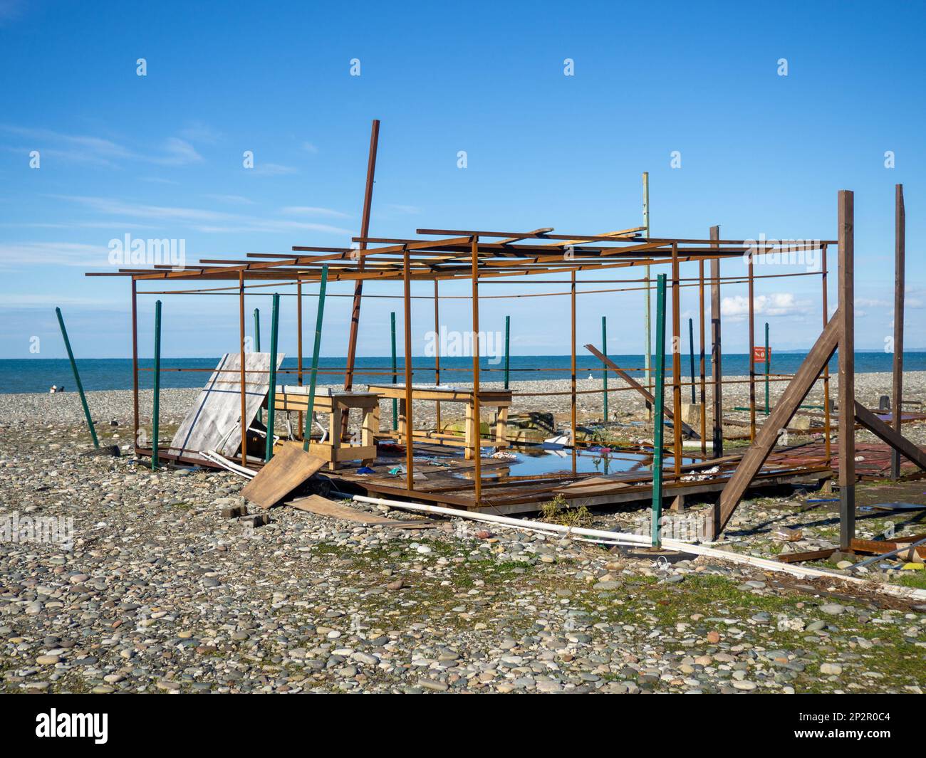 Ruined stall on the beach. Off-season. Abandoned business ...
