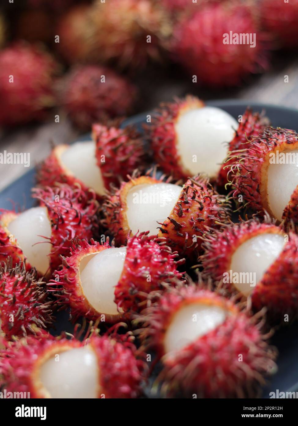 Delicious and sweet, Rambutan, tropical asia fruits, in black plate, on ...