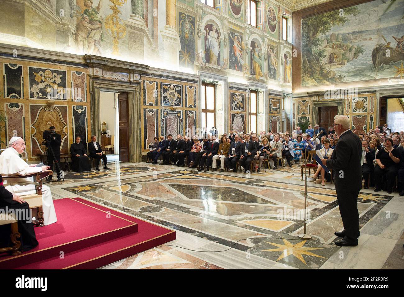 Pope Francis, left, attends a meeting of the International Council of ...