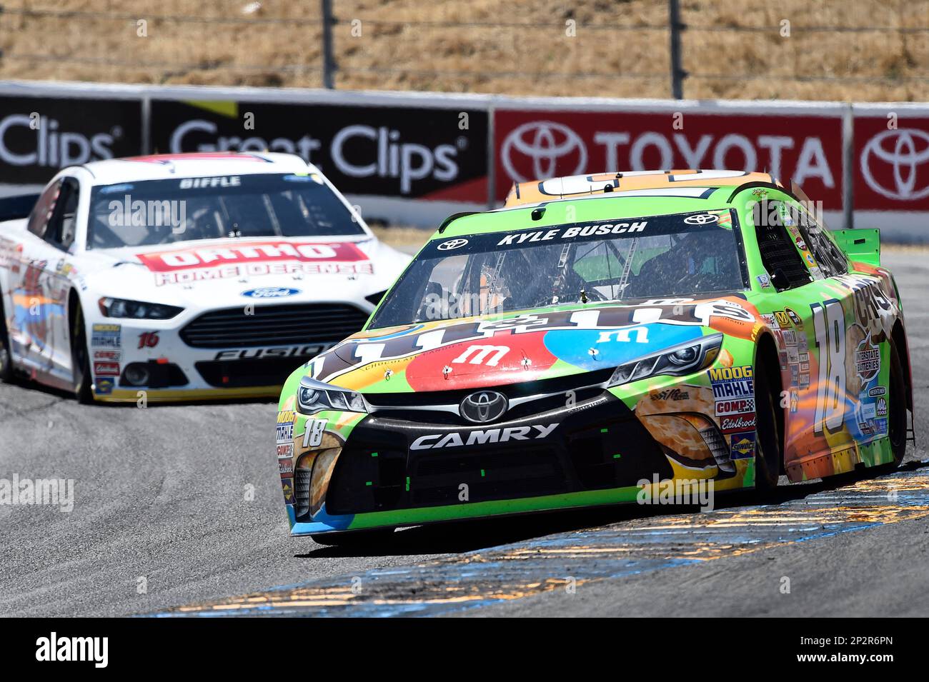 Kyle Busch, M&M's Crispy Toyota Camry (18) races with Austin Dillon (3 ...