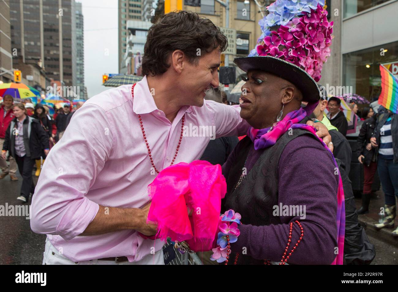 Federal Liberal Leader Justin Trudeau, left, greets reveller Truman ...