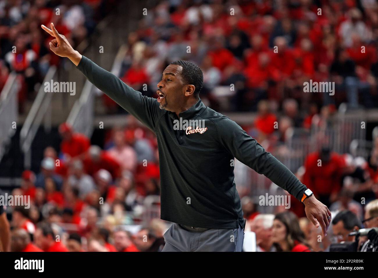 Oklahoma State coach Mike Boynton Jr. yells out to players during the ...