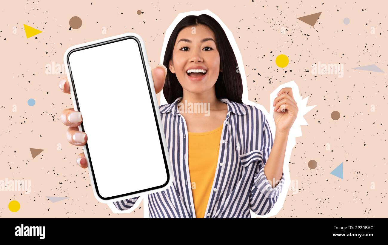 Positive young korean woman showing cell phone with mockup Stock Photo ...