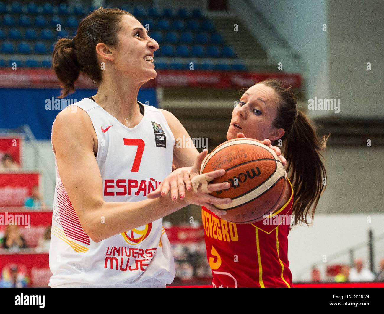 Alba Torrens, left, of Spain is challenged for the ball by Snezana ...