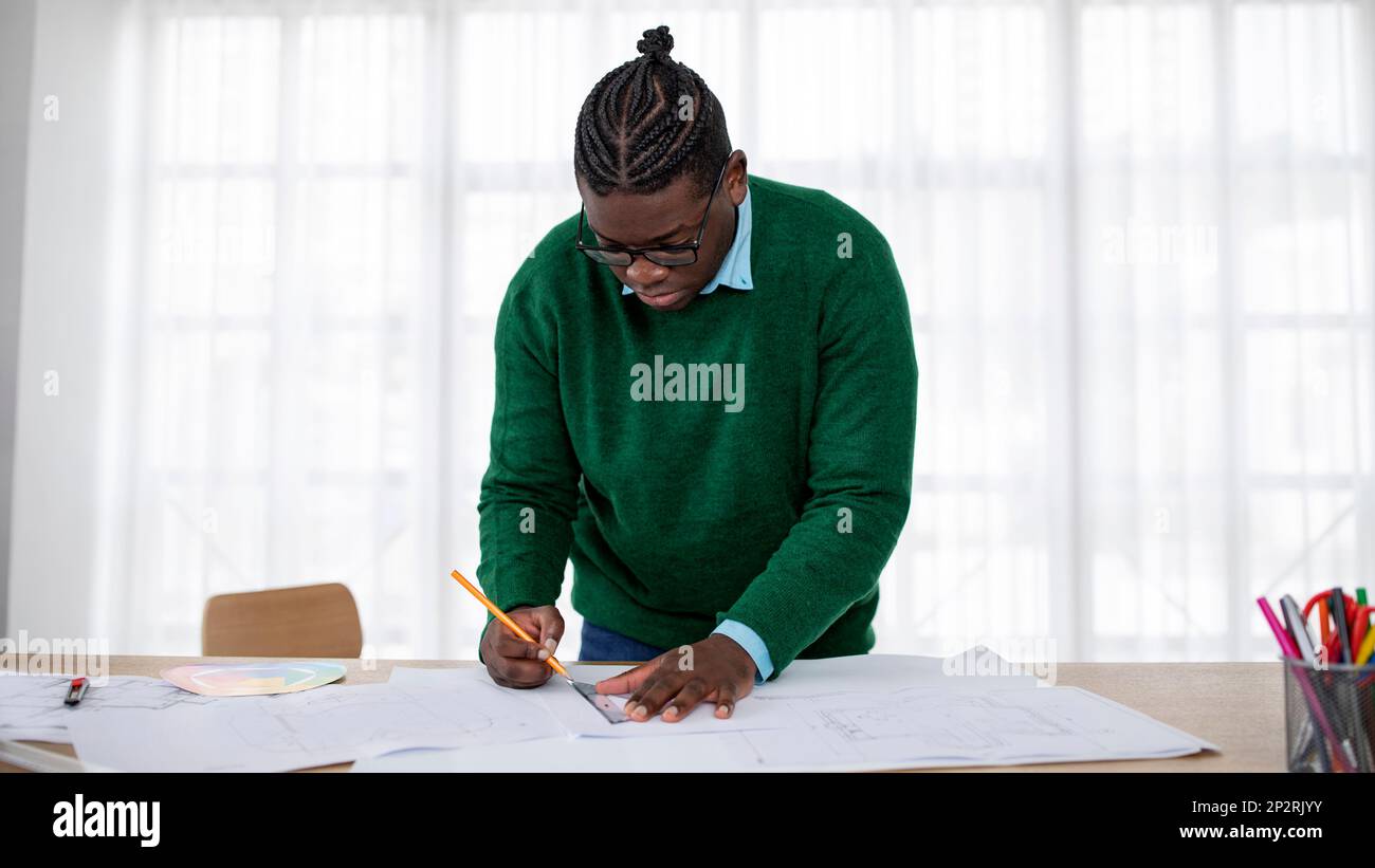 Black Designer Man Drawing House Plan Working In Modern Office Stock ...