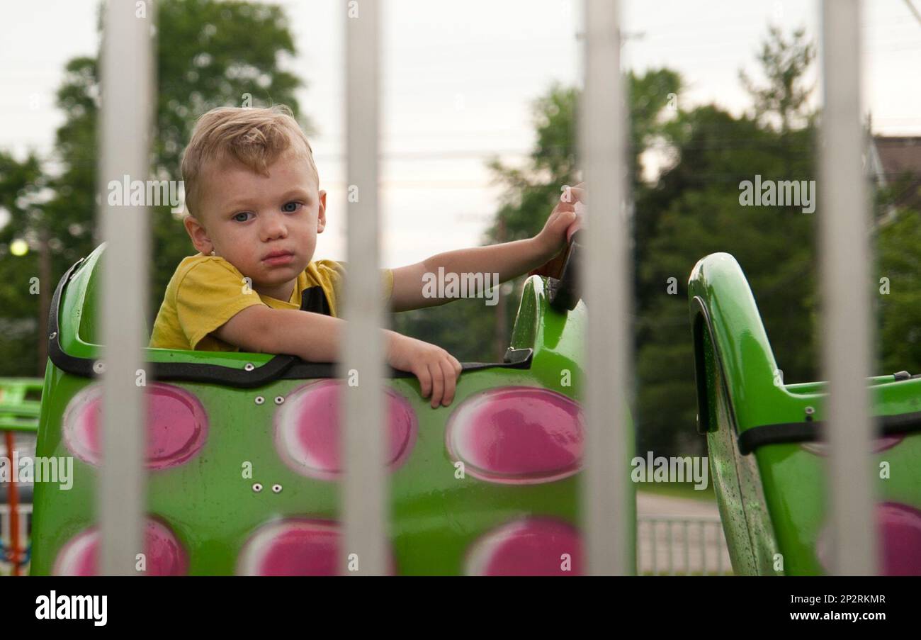 Matthew Bremiller III, 2, gets ready to ride the roller coaster during ...
