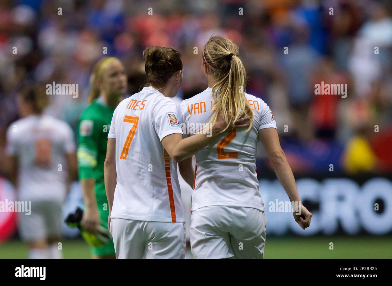 Netherlands' Manon Melis, left, consoles teammate Desiree van Lunteren ...
