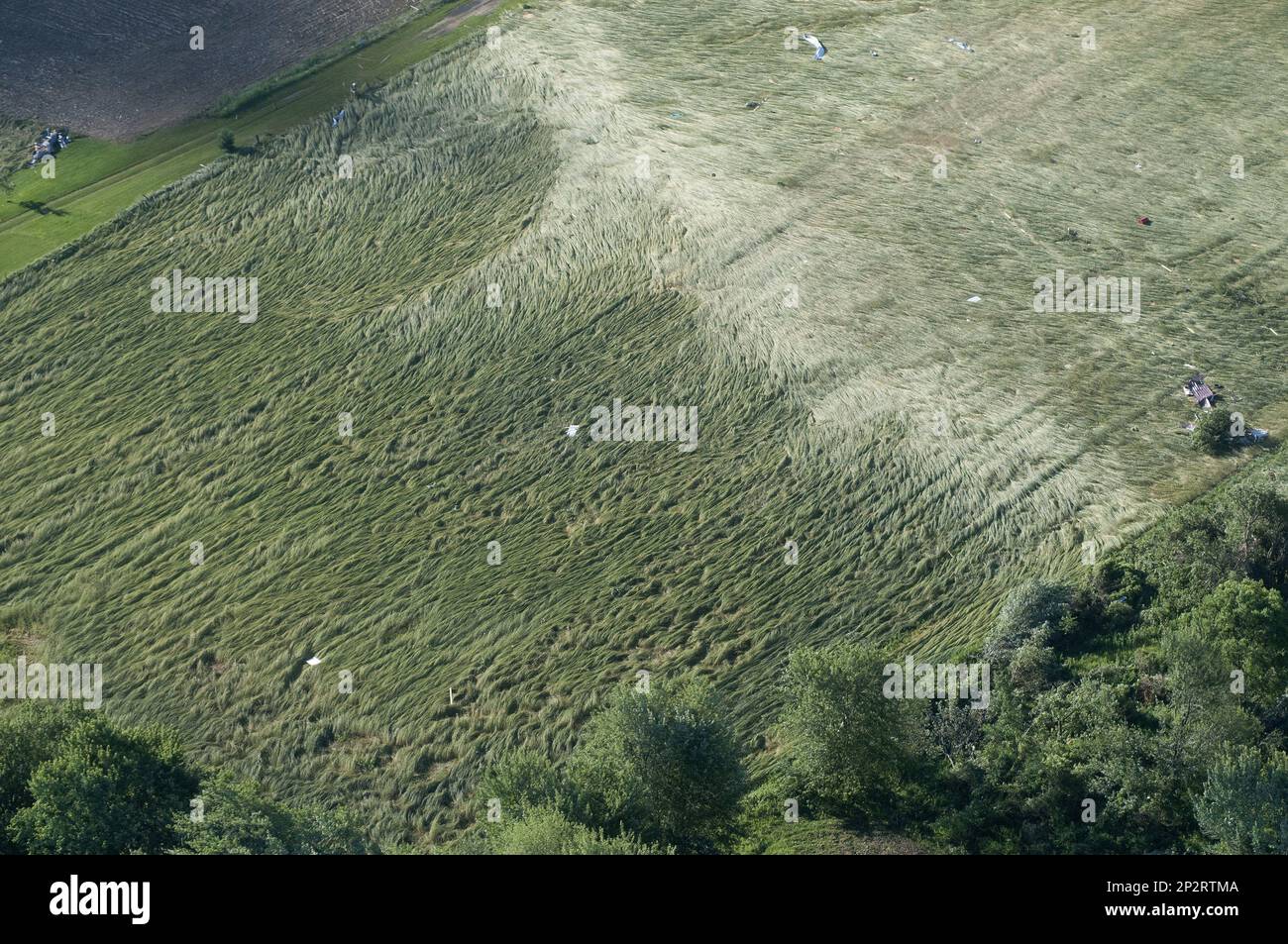 This aerial photo shows a farm field that shows evidence of wind damage ...
