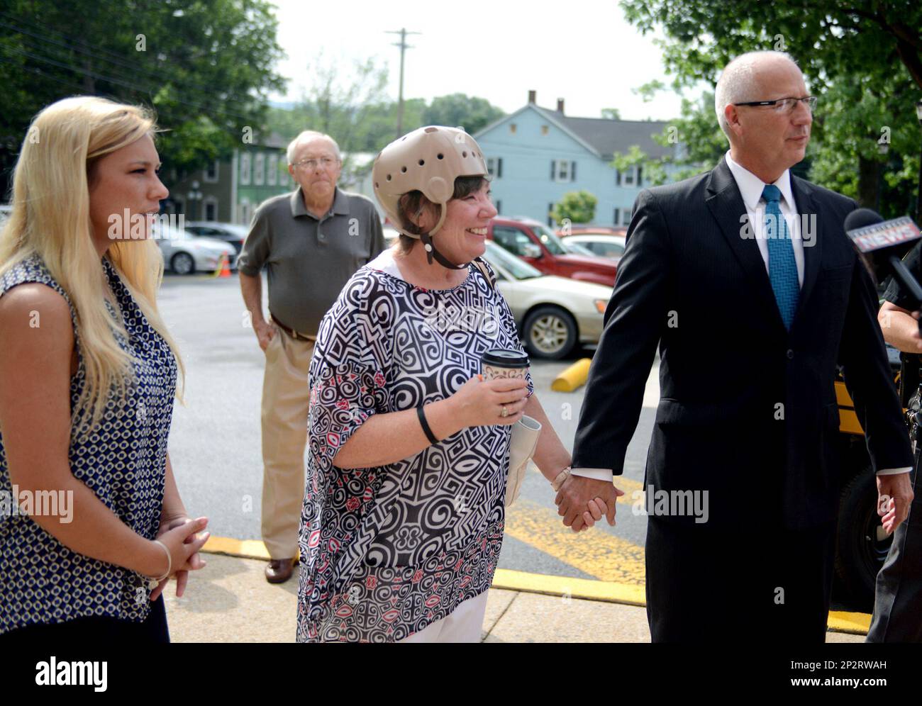 Sharon and Randy Budd, along with their daughter Kaylee, enter the ...