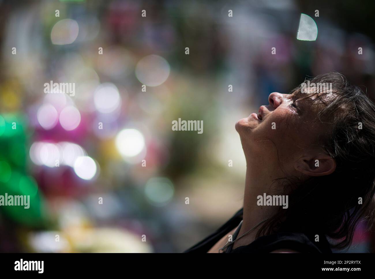 Auburn Sandstrom cries while praying at a sidewalk memorial in memory ...