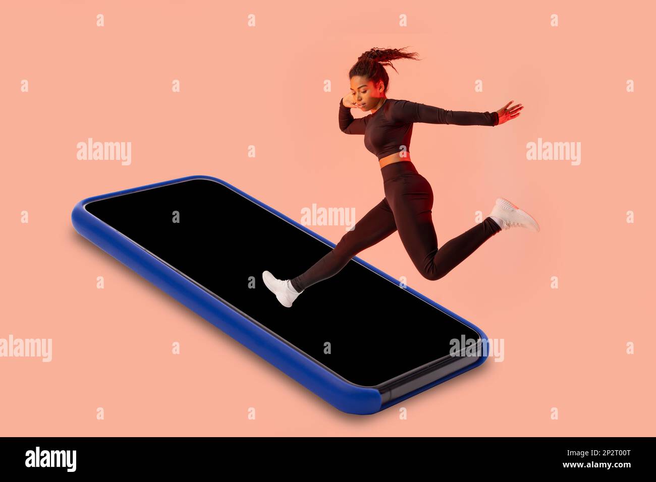Fitness app. Black woman jumping on smartphone blank screen, having ...
