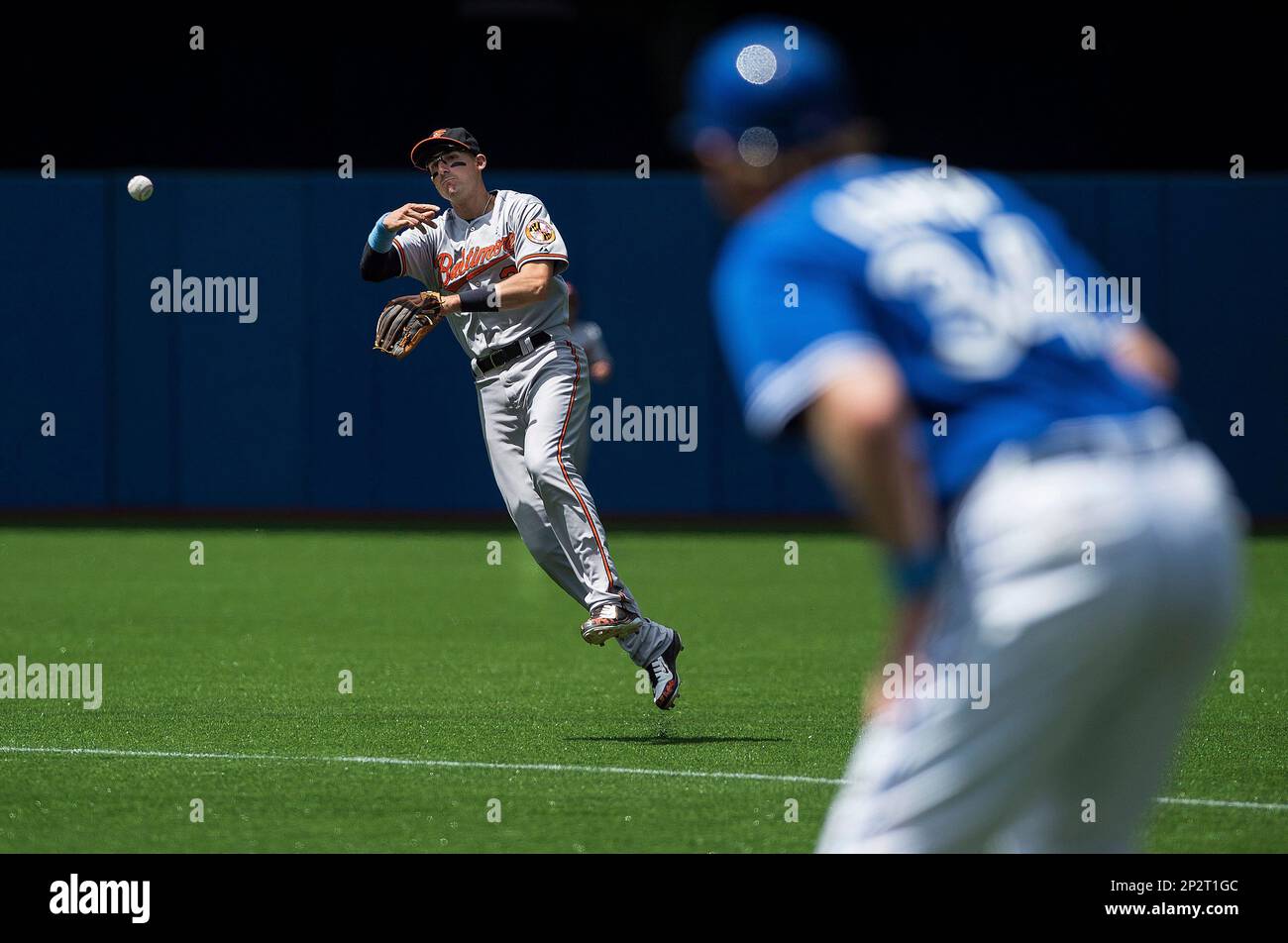 Baltimore Orioles Ryan Flaherty throws out Toronto Blue Jays Justin ...