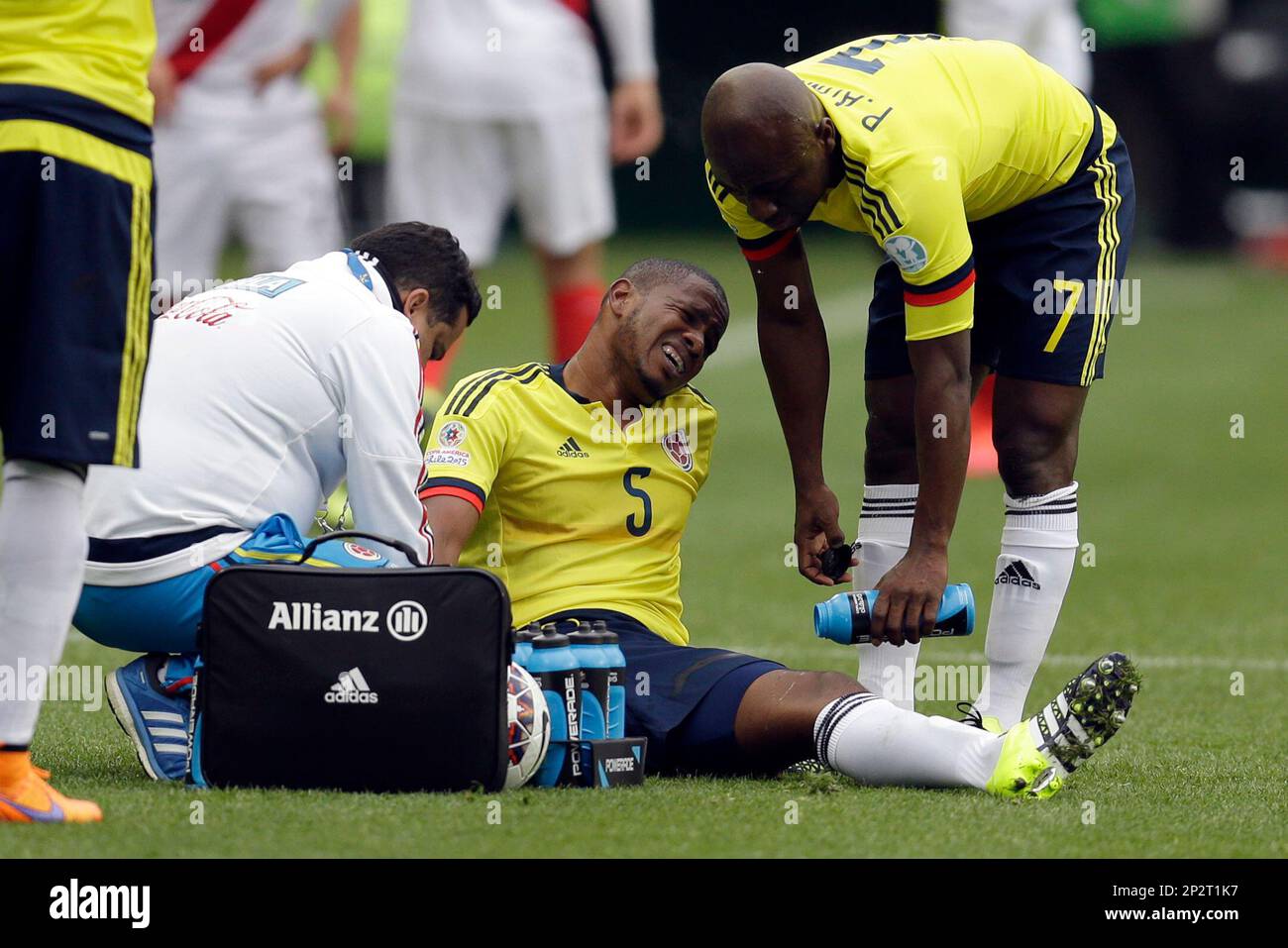 Colombia's Edwin Valencia is assisted after injuring himself during a ...