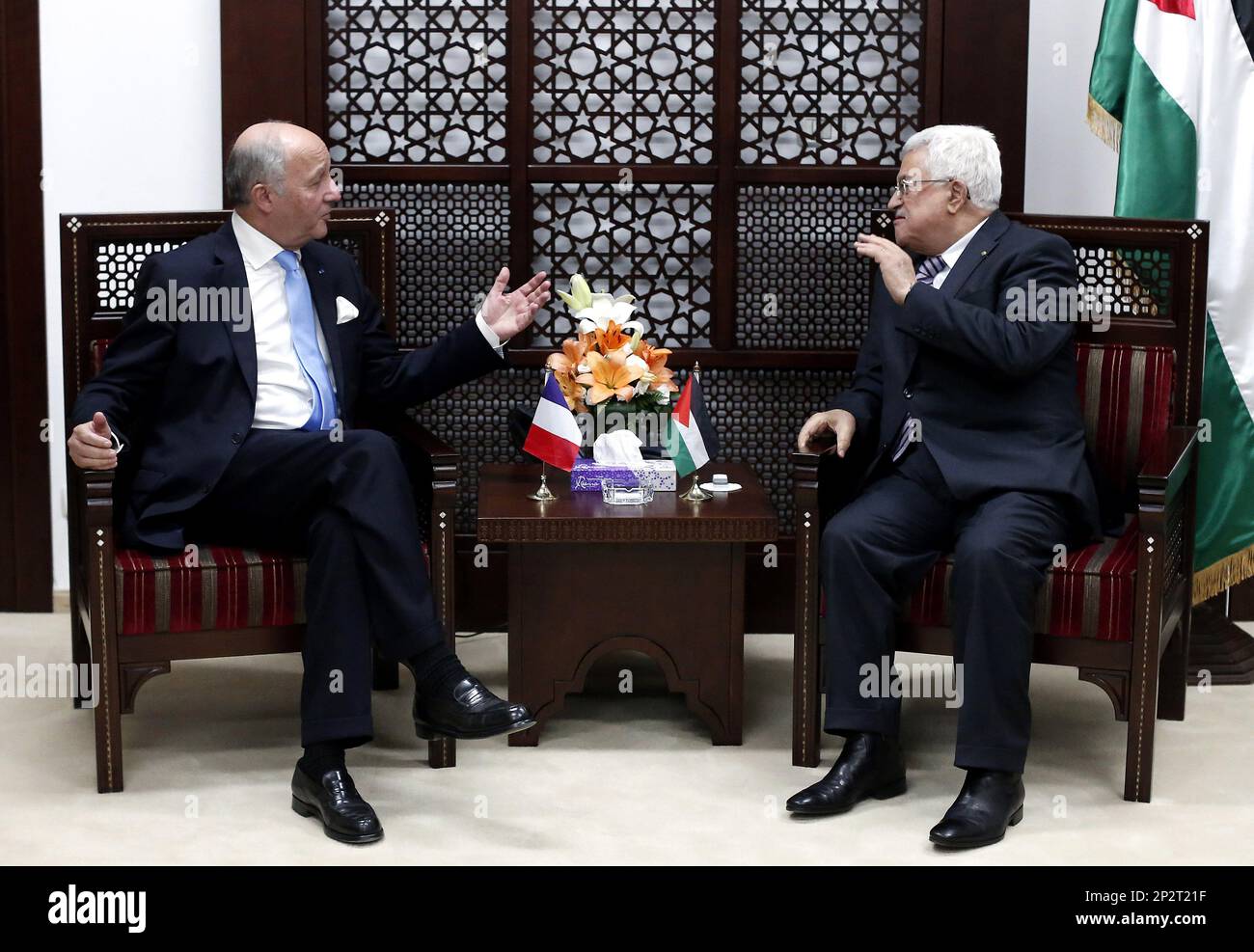 French Foreign Minister Laurent Fabius, left, speaks with Palestinian ...