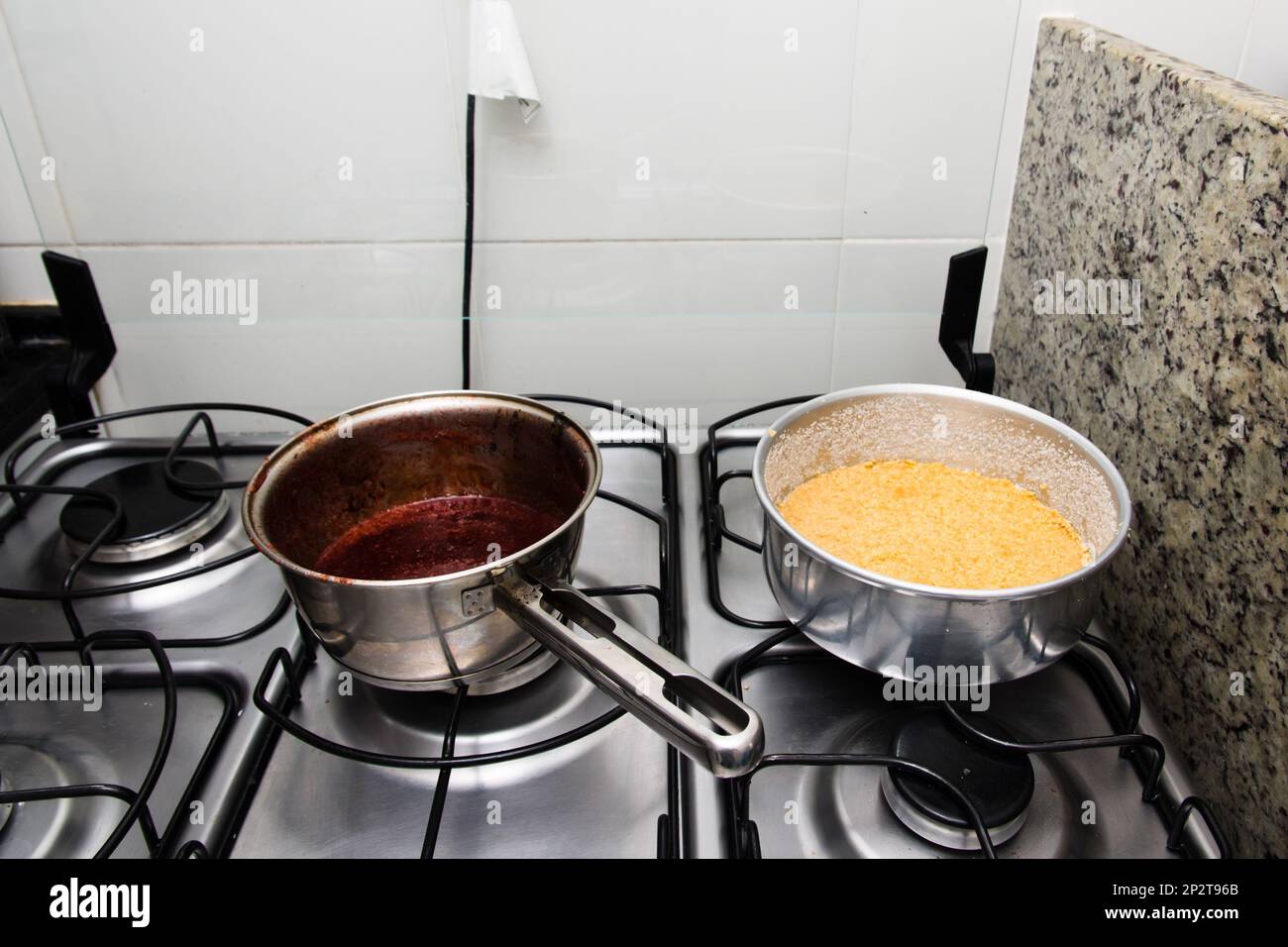 Two frying pans in the oven preparing the cheesecake. family gastronomy ...