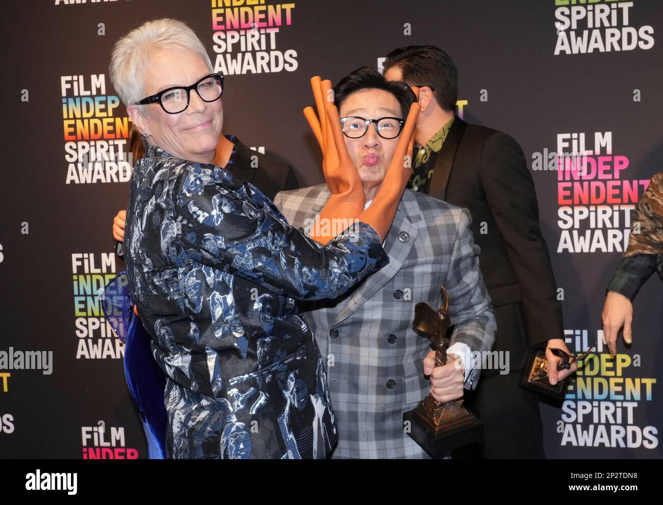 Jamie Lee Curtis, left, wearing hot dog fingers based on a prop from ...